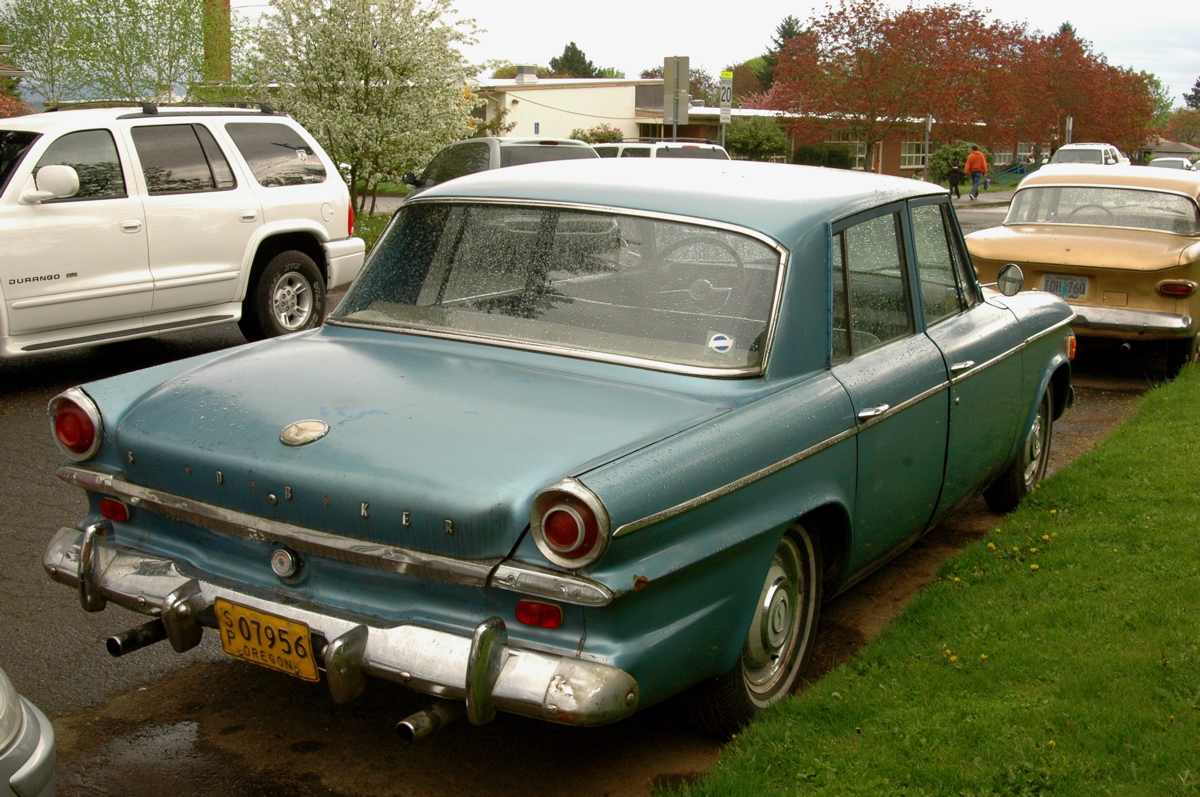 OLD PARKED CARS.: Pair of Larks: 1962 Studebaker Lark Sedan.