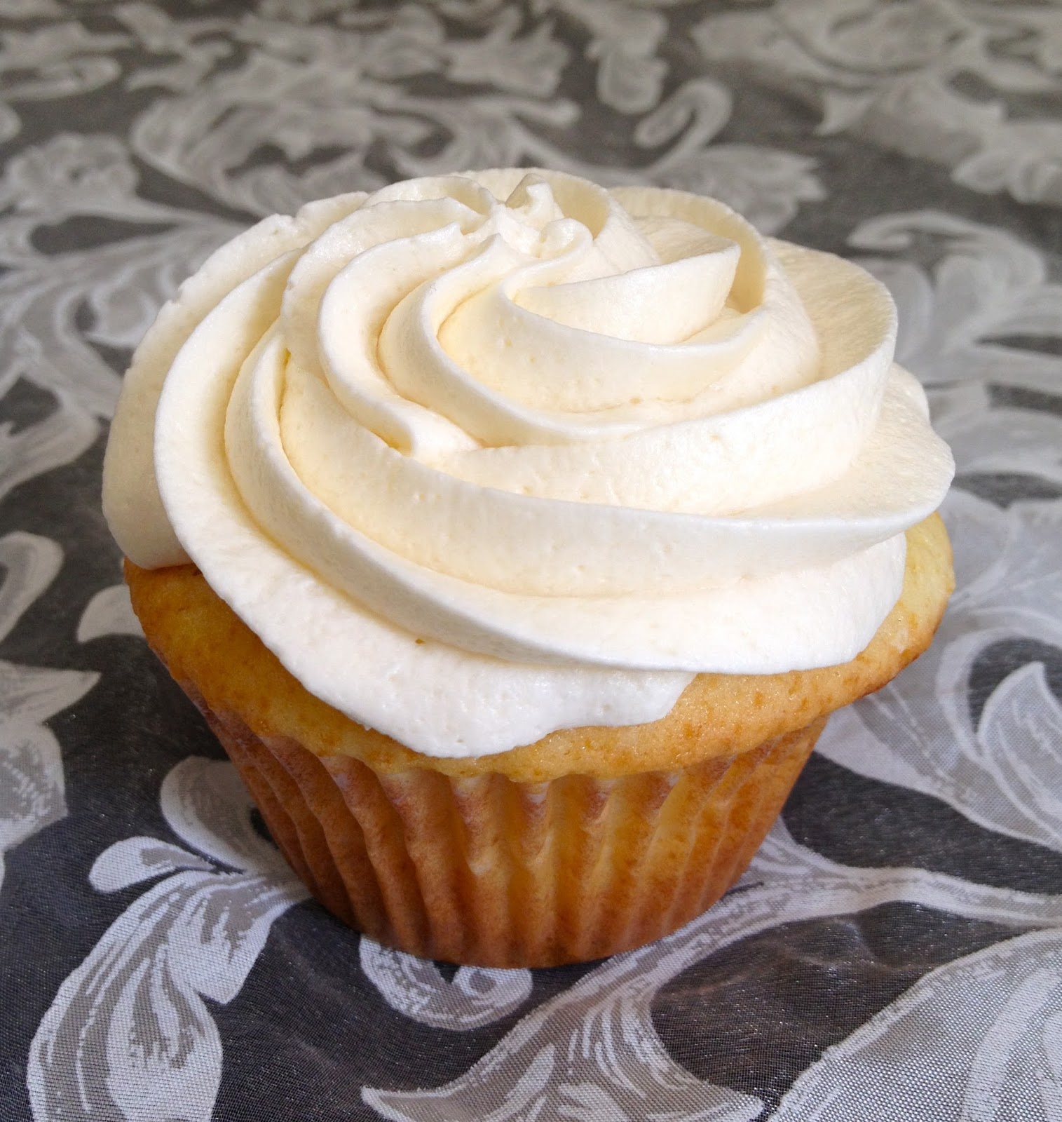 White Cupcakes With Raspberry Filling Swirl Of Cinnamon white-cupcakes-with-raspberry-filling-swirl-of-cinnamon
