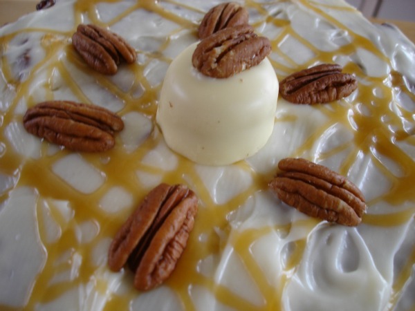 I garnished this cake with pecan halves and a white chocolate truffle ...