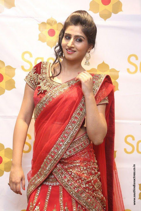Varshini Sounderajan in red half saree stills - South Indian Actress