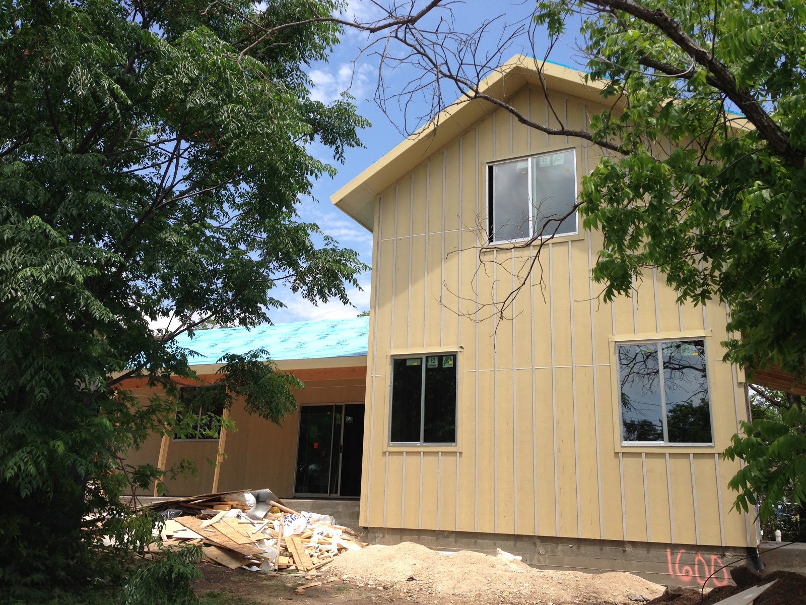 This New House: House Wrap, Windows, and Siding begins