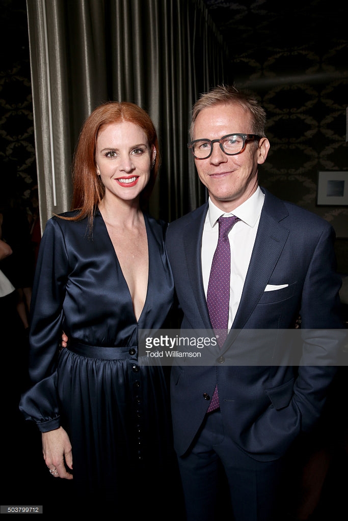 Ladies in Satin Blouses: Sarah Rafferty - navy satin dress