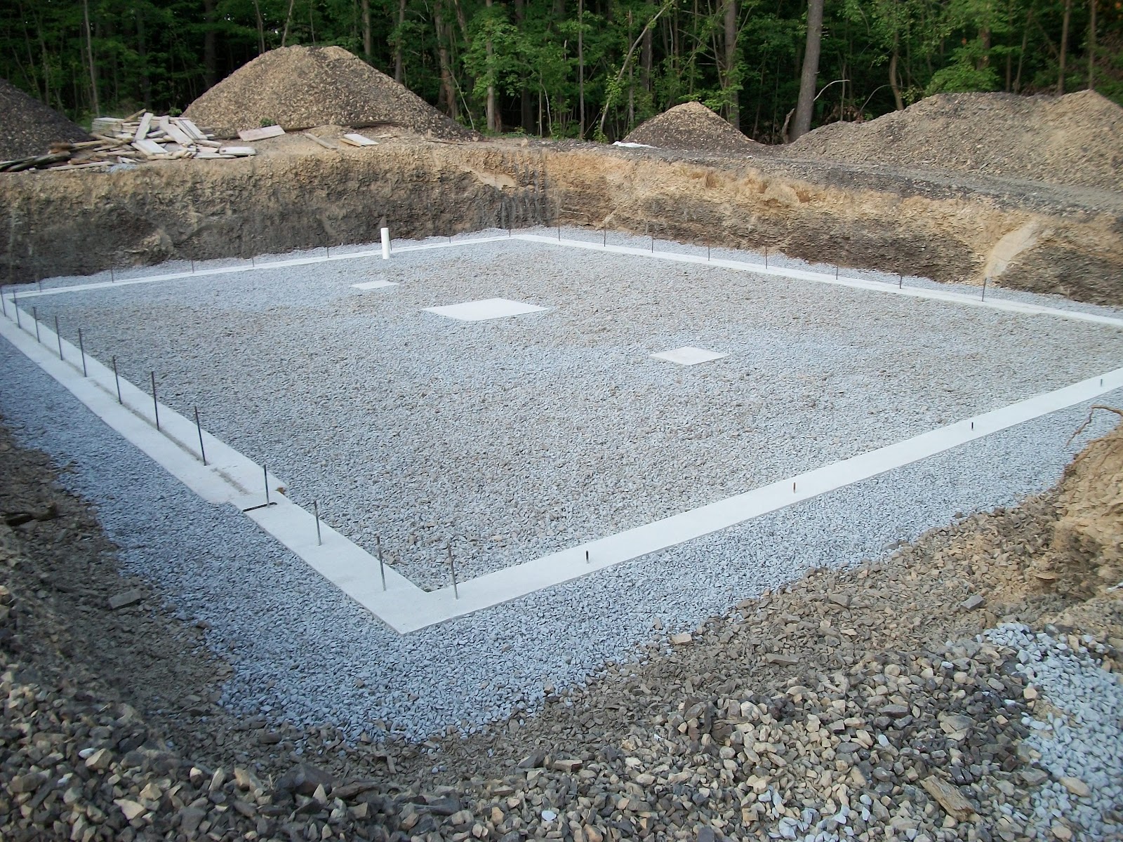 Girl Builds House: Sub-slab #2 stone and footing drain tile.