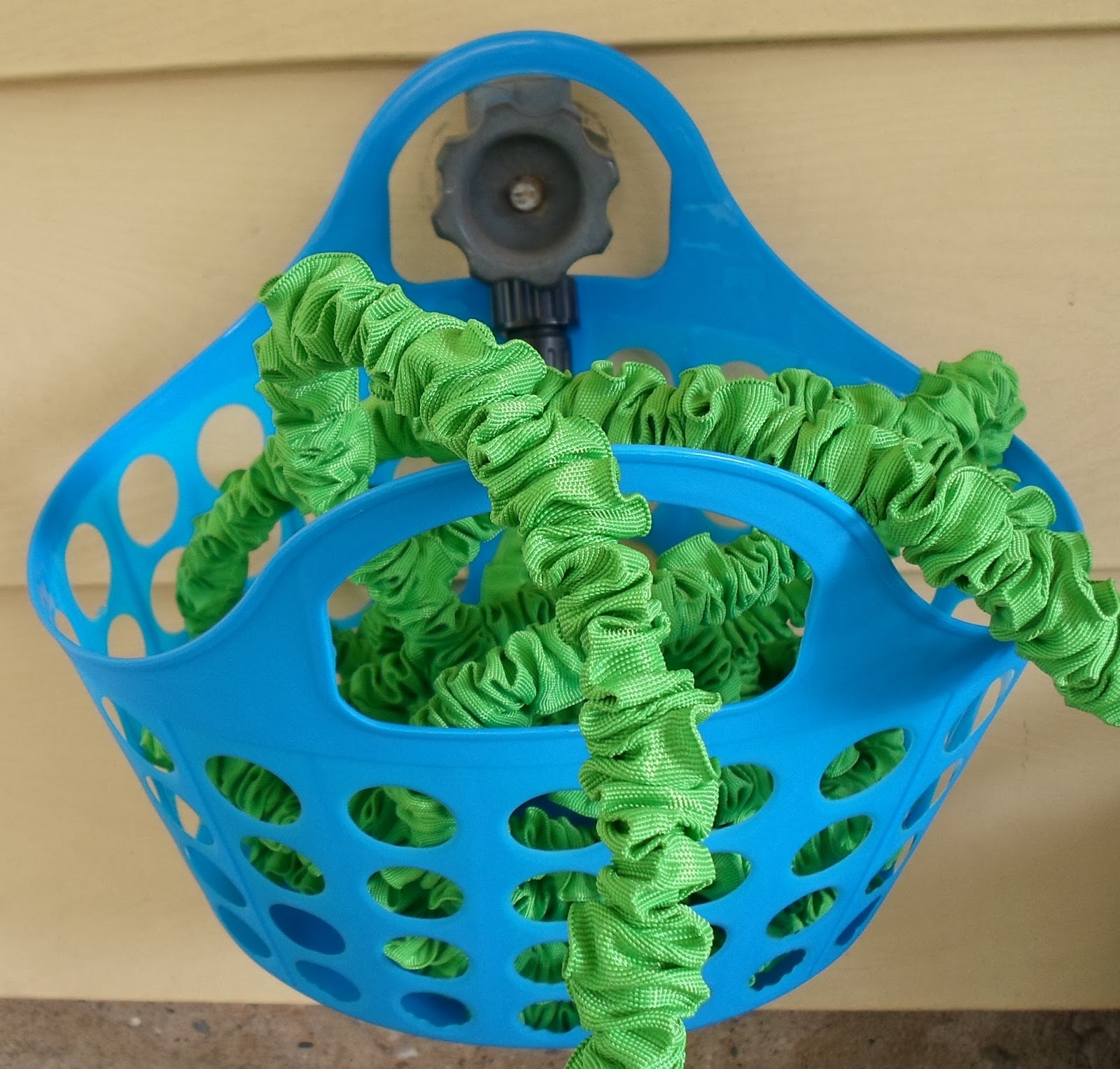 Happier Than A Pig In Mud: $1 Hanging Storage for a Flexible Hose