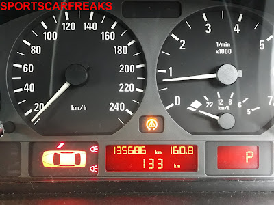 The orange triangle with arrow warning light is ASC (Automatic ...
