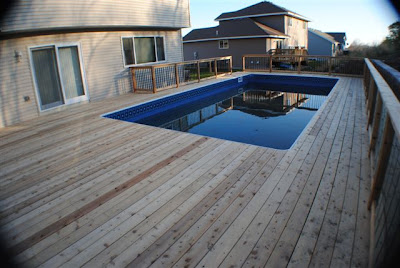 PENGUIN POOLS: Inground pool built into slope and decked