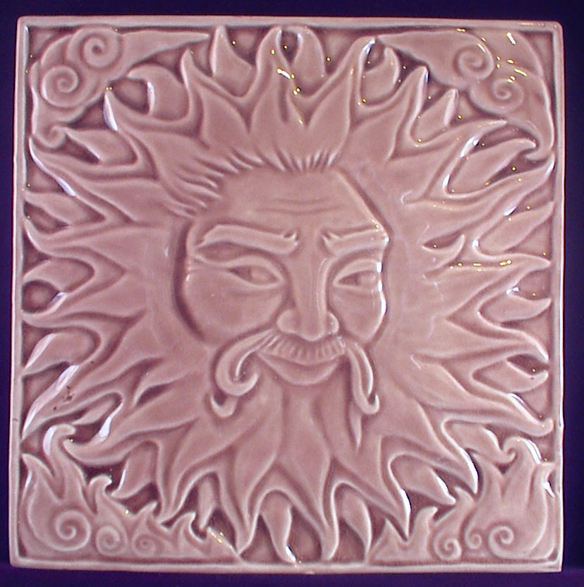 Decorative handmade ceramic tile: Decorative relief carved ceramic sun tile