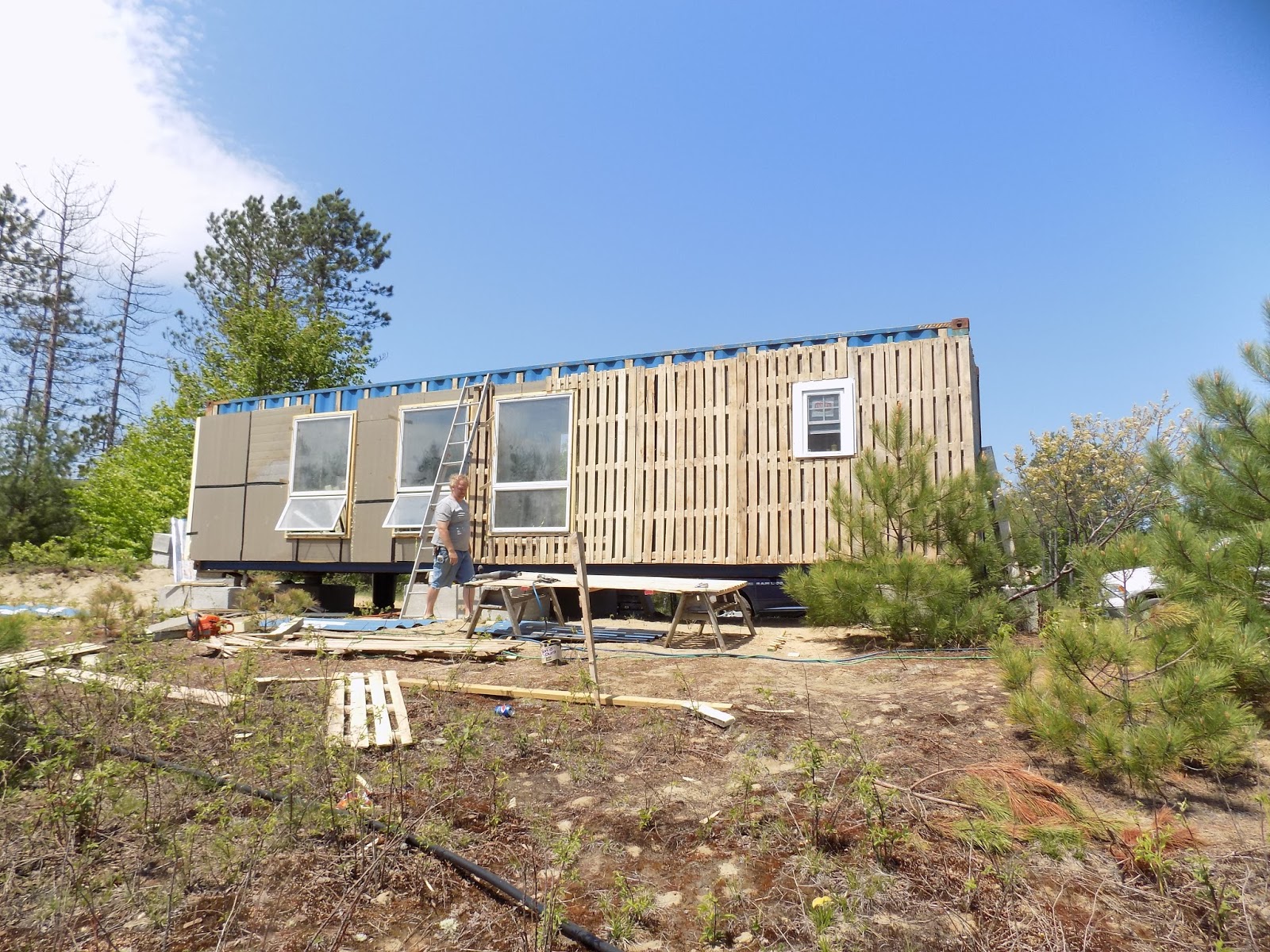 Intermodal House: Strapping on, Windows in, Insulation, Siding Mostly on