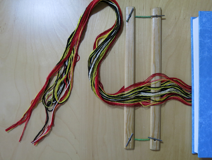 Durham Weaver: Making a warp and threading the 9 pattern slot heddle.