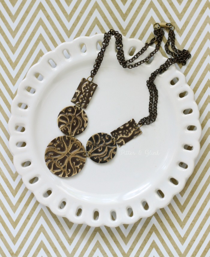 PitterAndGlink: Embossed Metal & Bead Tassel Necklace
