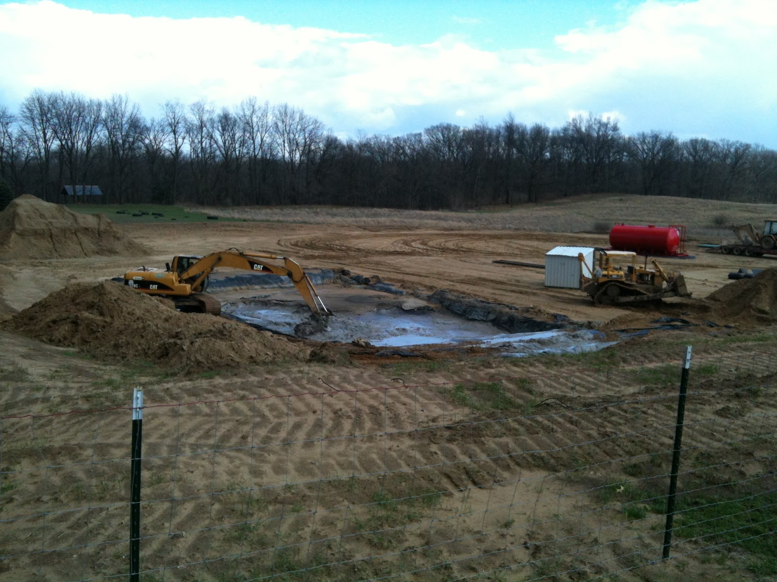 Adrian - Oil and Gas: Pipeline Lined Up - Open Pit on Drill Site in ...