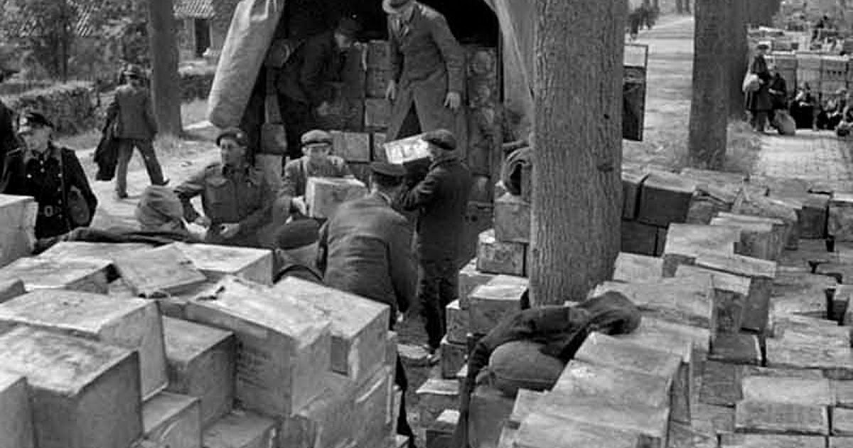 World War II Pictures In Details: Dutch Civilian Load a Canadian Truck ...