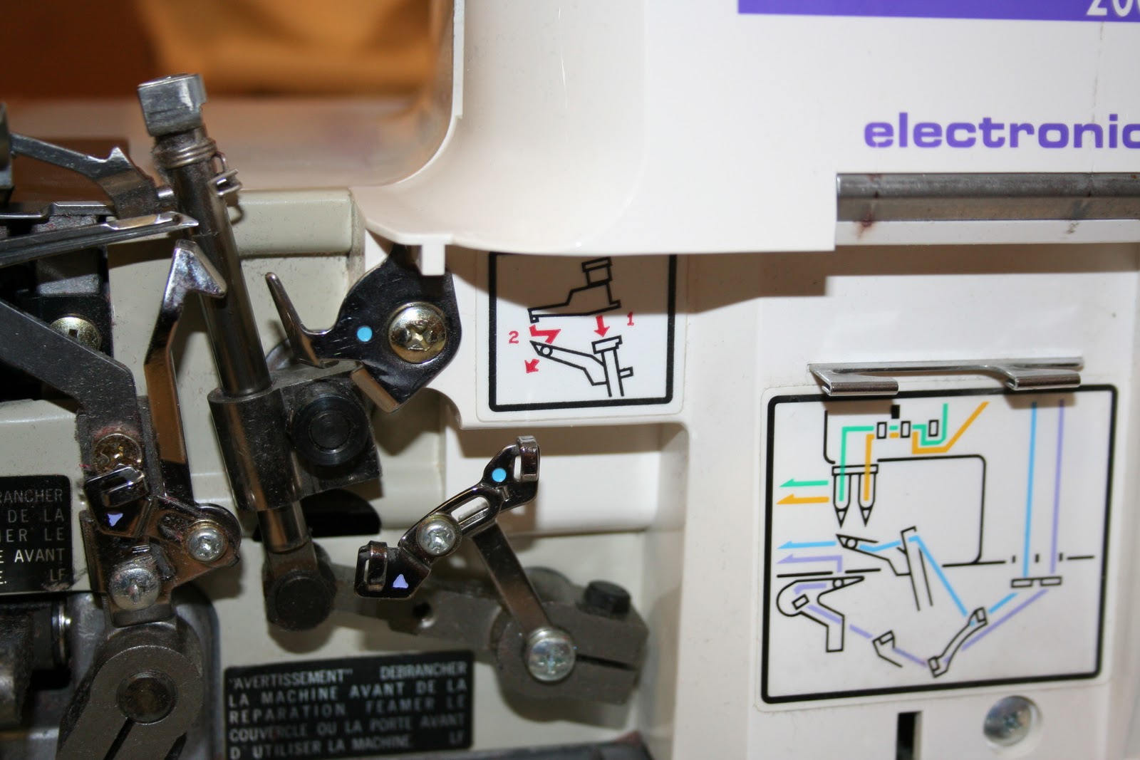 Tammy's Craft Emporium: White Superlock 2000 serger and dog bed.