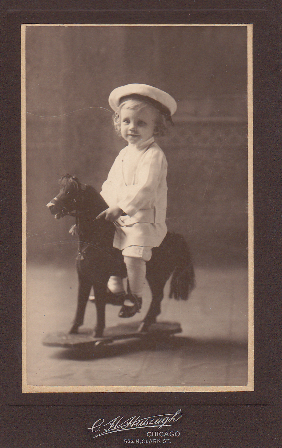 Old Fashioned Kids With Large Toy Horses | sweet juniper inspiration