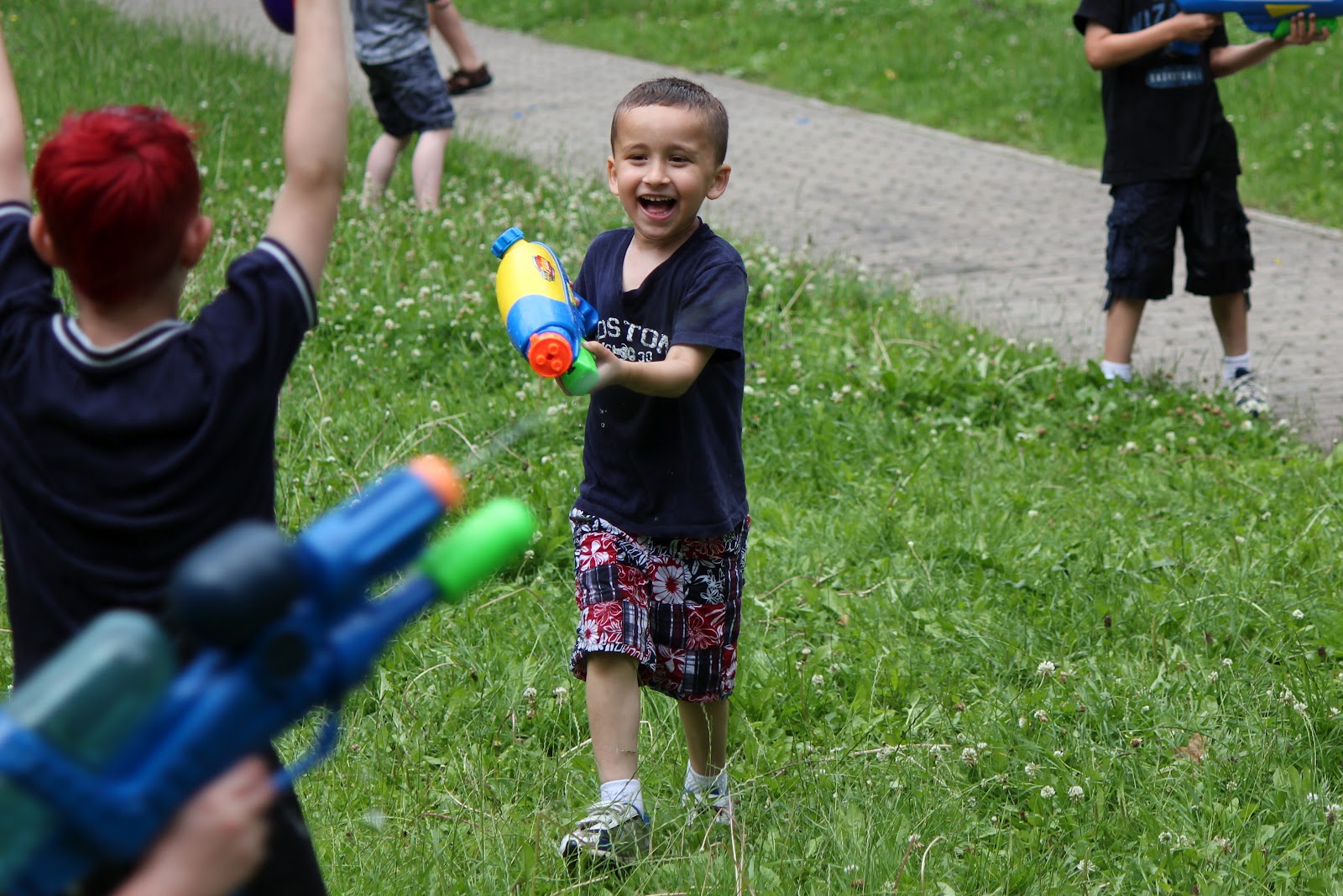 A Walk Down Narulastraße: Raingutter regatta and a water gun fight