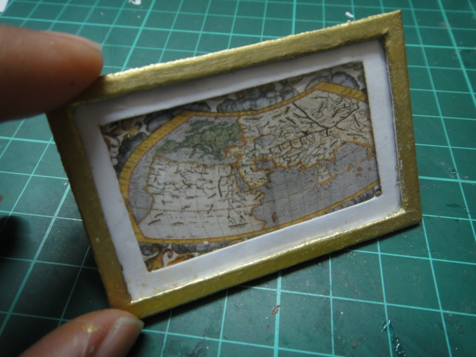 Art some craft: Framing a miniatiature ancient map