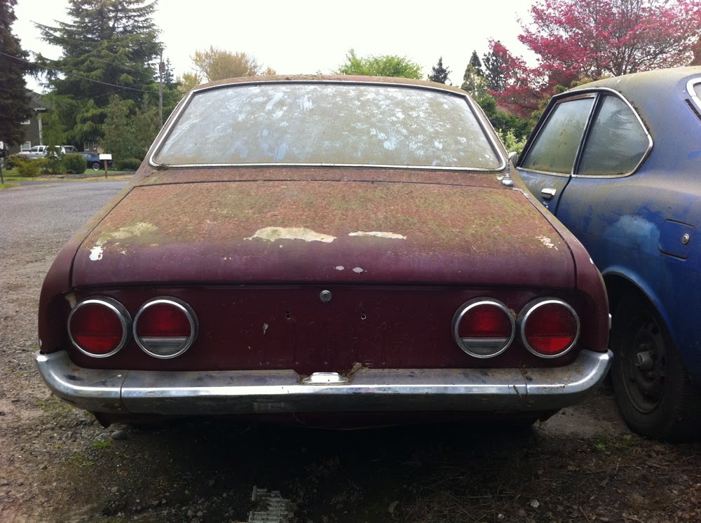 OLD PARKED CARS.: Mossy Mazda #2: Badgeless 1971 Mazda R100 Coupe.