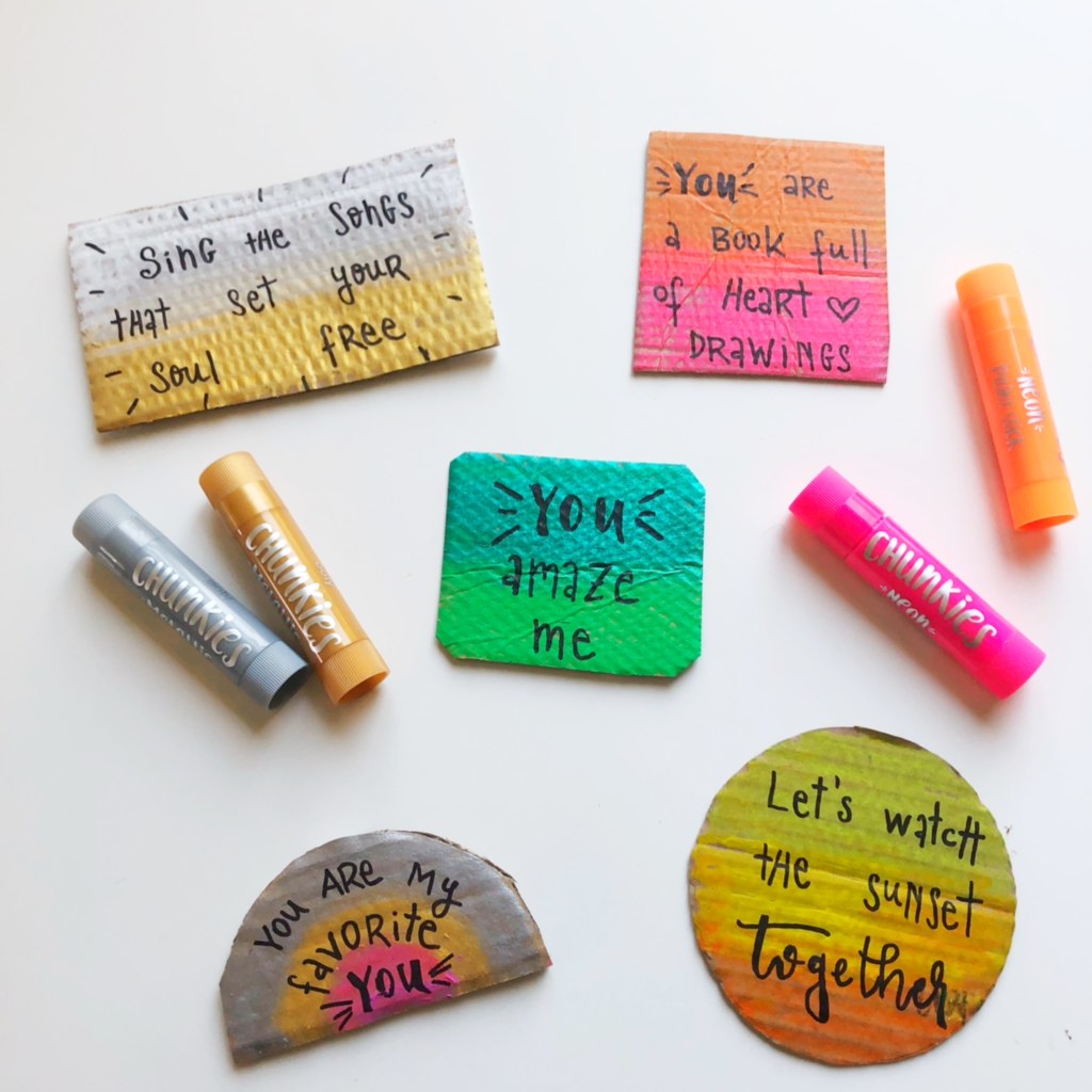 Kindness messages created with recycled cardboard boxes