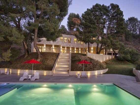 A Unique Estate Encased in beautiful Travertine Stone. It features ...