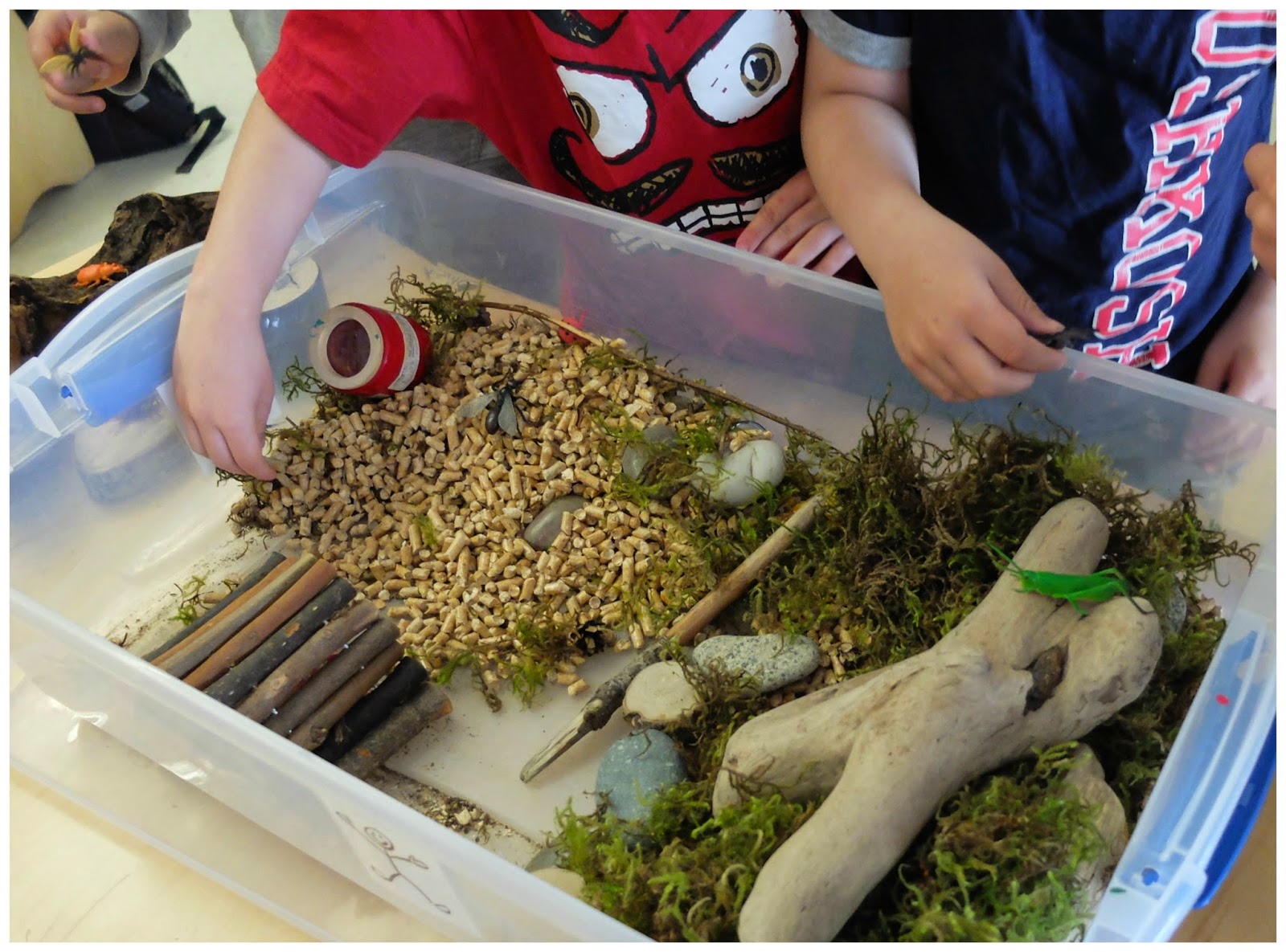 insect sensory bin - rubber boots and elf shoes