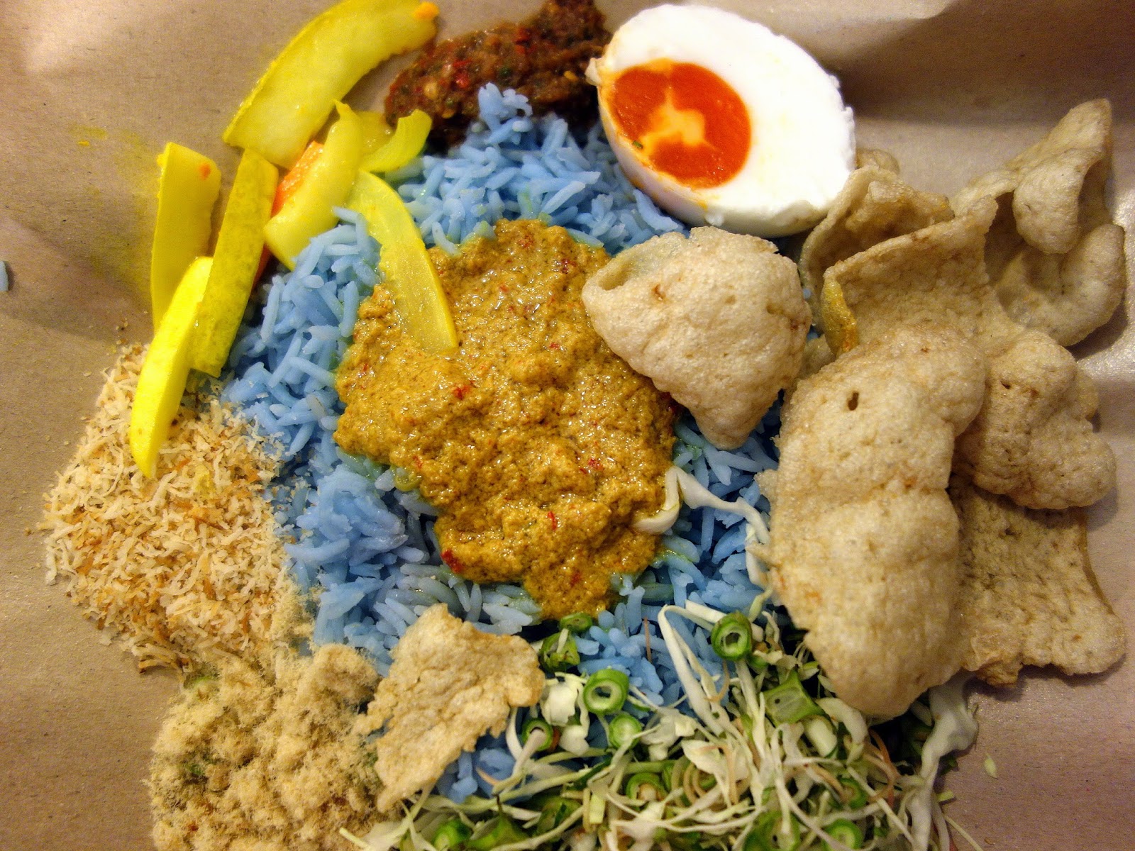 Kesom's Nasi Kerabu (RM10.90) meets the mark, tastily built with blue ...