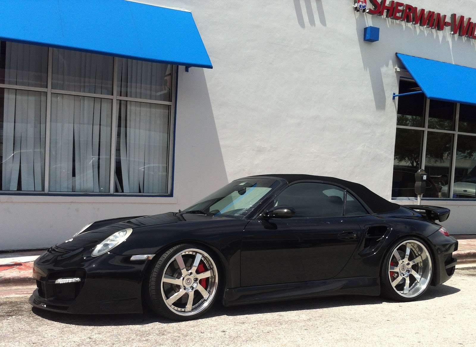 Black Porche 911 Turbo S with custom rims