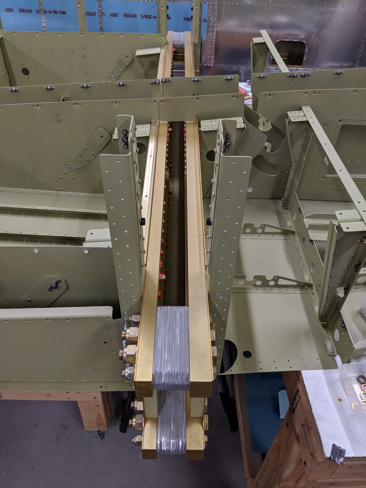 Damazio family's RV-10 project: Forward fuselage bottom skins riveted