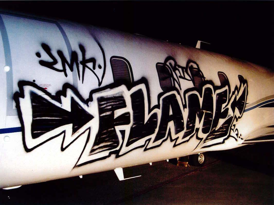 Graffiti on private jet at Van Nuys Airport (LA) - damage estimated at ...