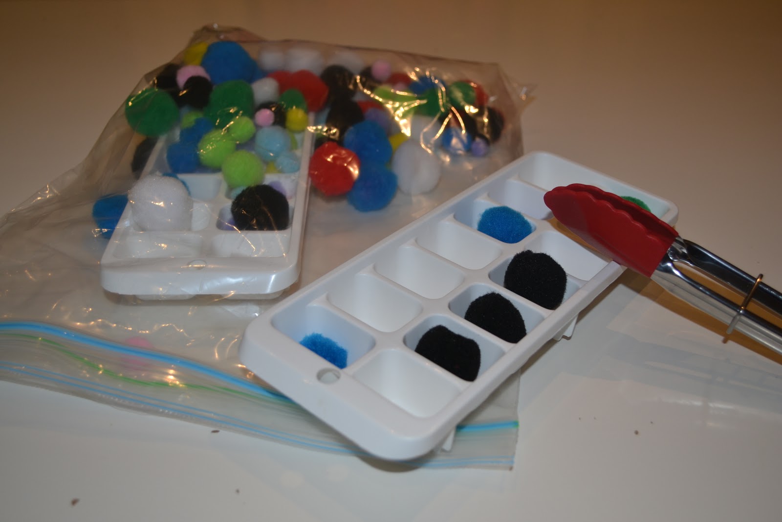 Happy Little Munchkins: What Do Pom Poms and Ice Cubes Have In Common?