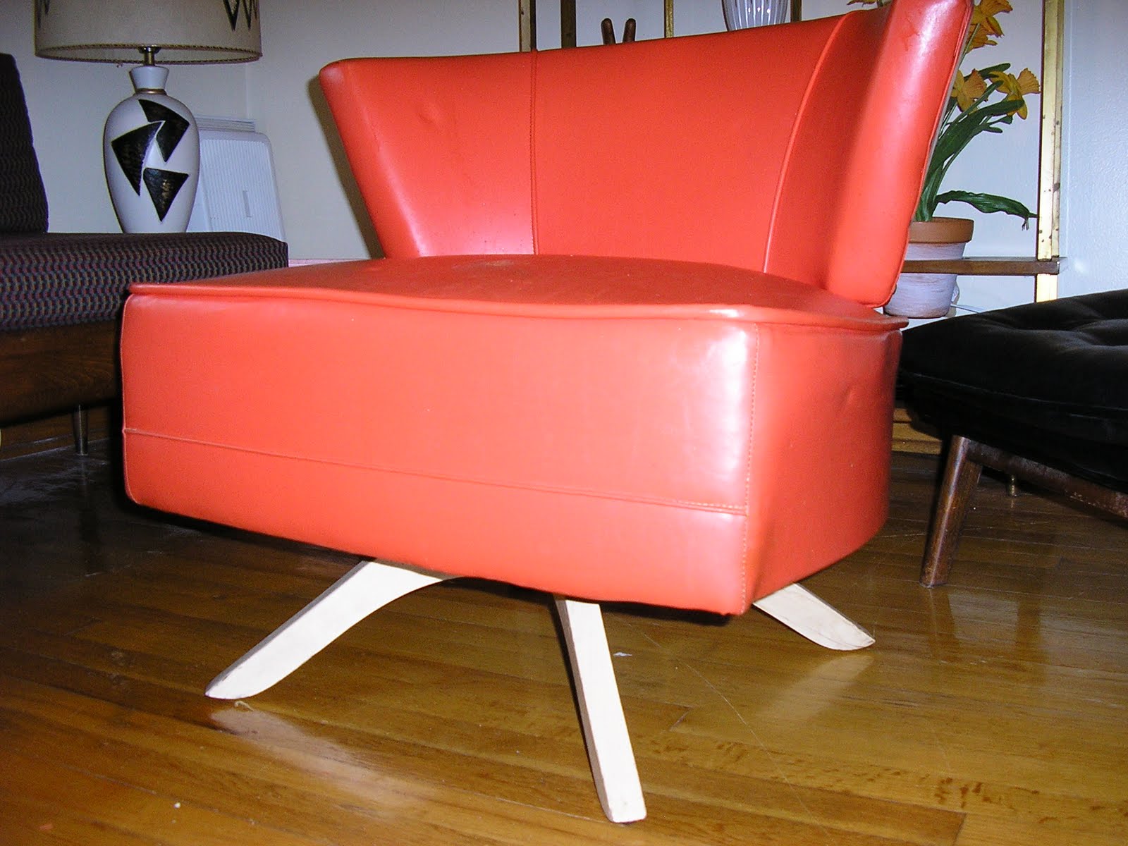 mod about you: Orange Vinyl Swivel Chair $75 - Sold