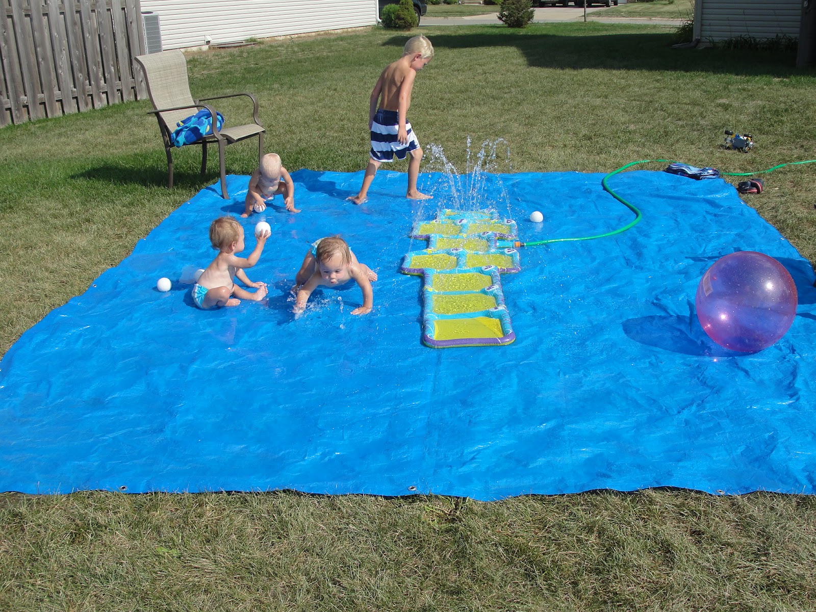 1 Little Dude and 3 Little Ladies: It's Our very Own Splash Pad