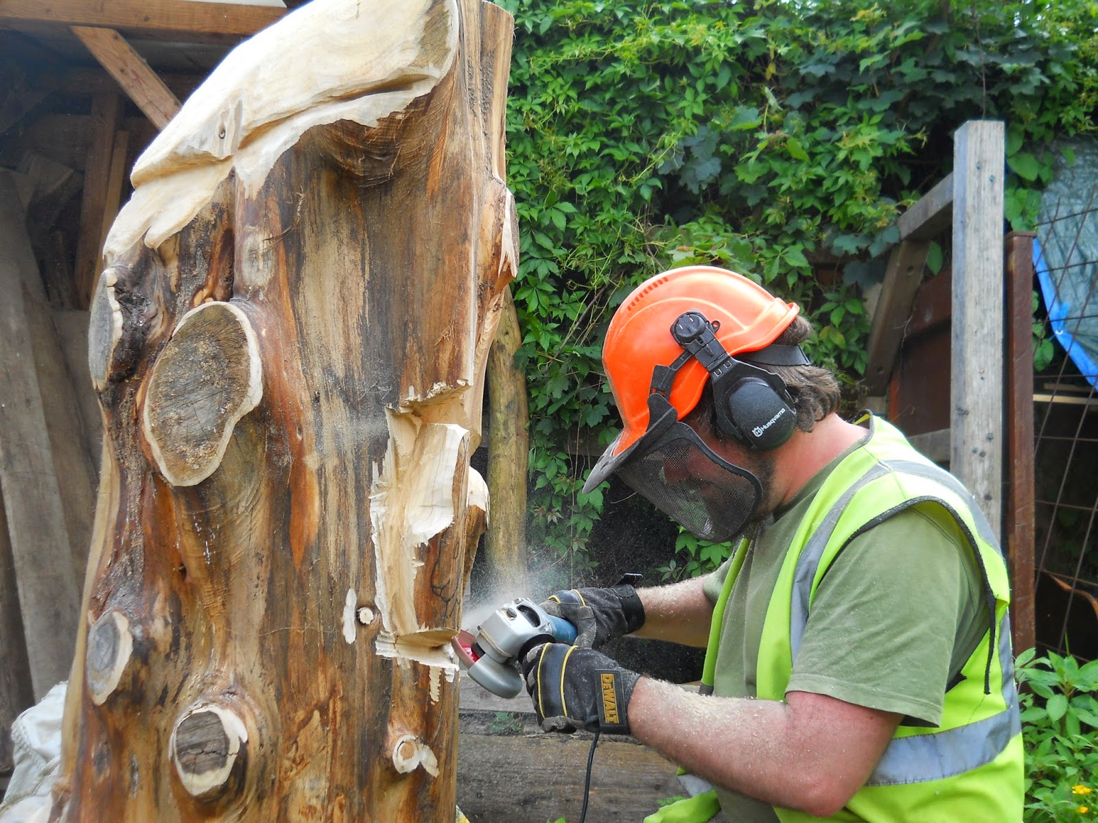 A carved cedar log as a sign for Rock Meadow, a new housing development ...