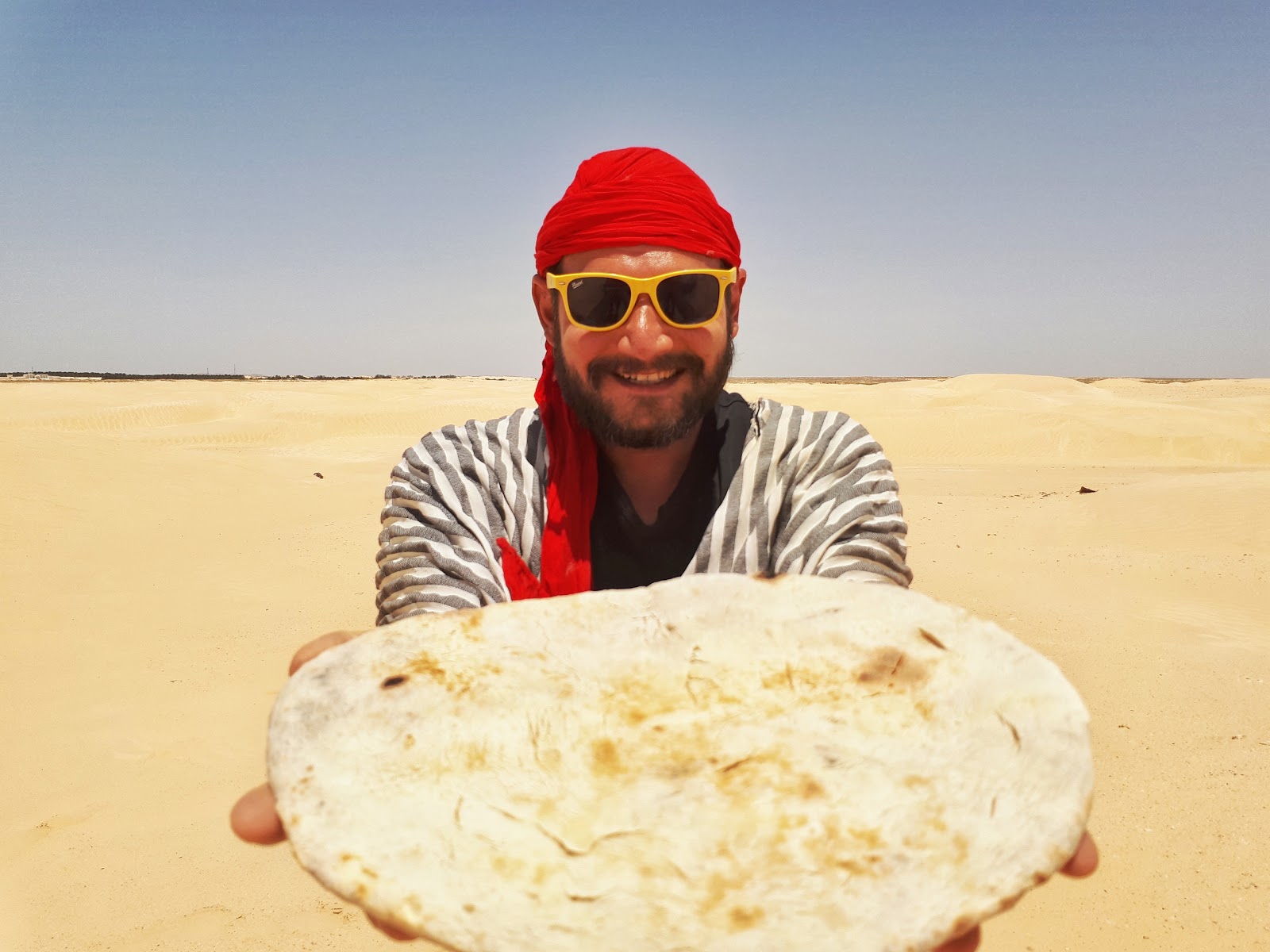 Baking bread aka 'Pain de sable' in the Sahara desert in Tunisia | The ...