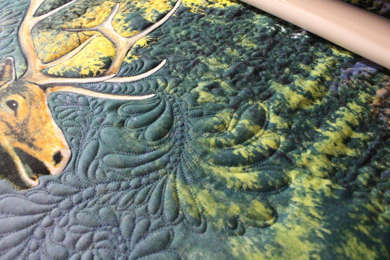 Sarah Lynn's Quilting: Half Done Quilting the Elk Panel Quilt