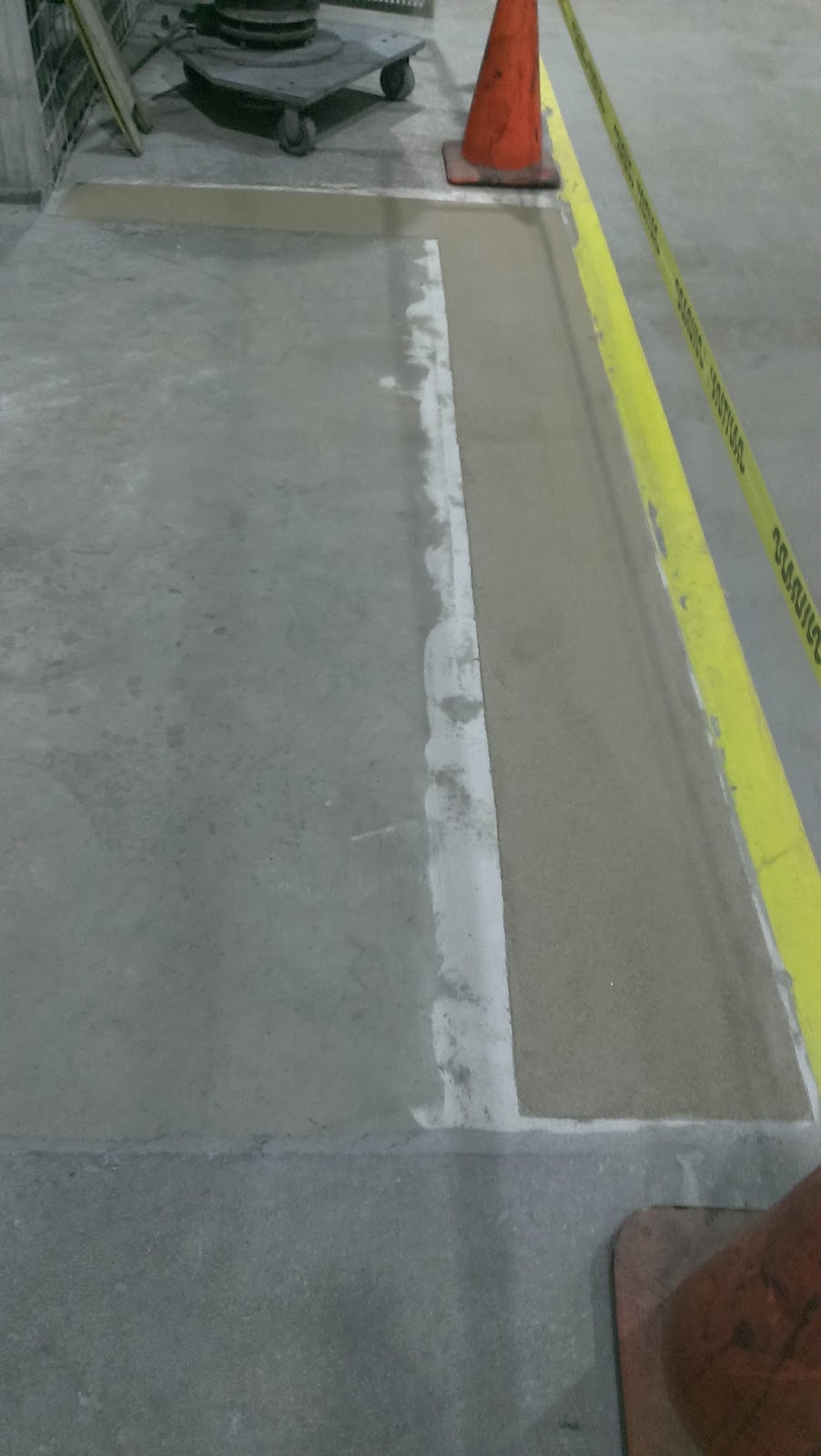 Epoxy Floor Coatings: Building water containment curb - Gainesville, Texas
