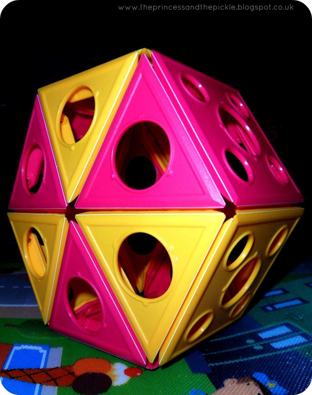 Triqo consists of brightly coloured 2D triangles and squares. These can ...