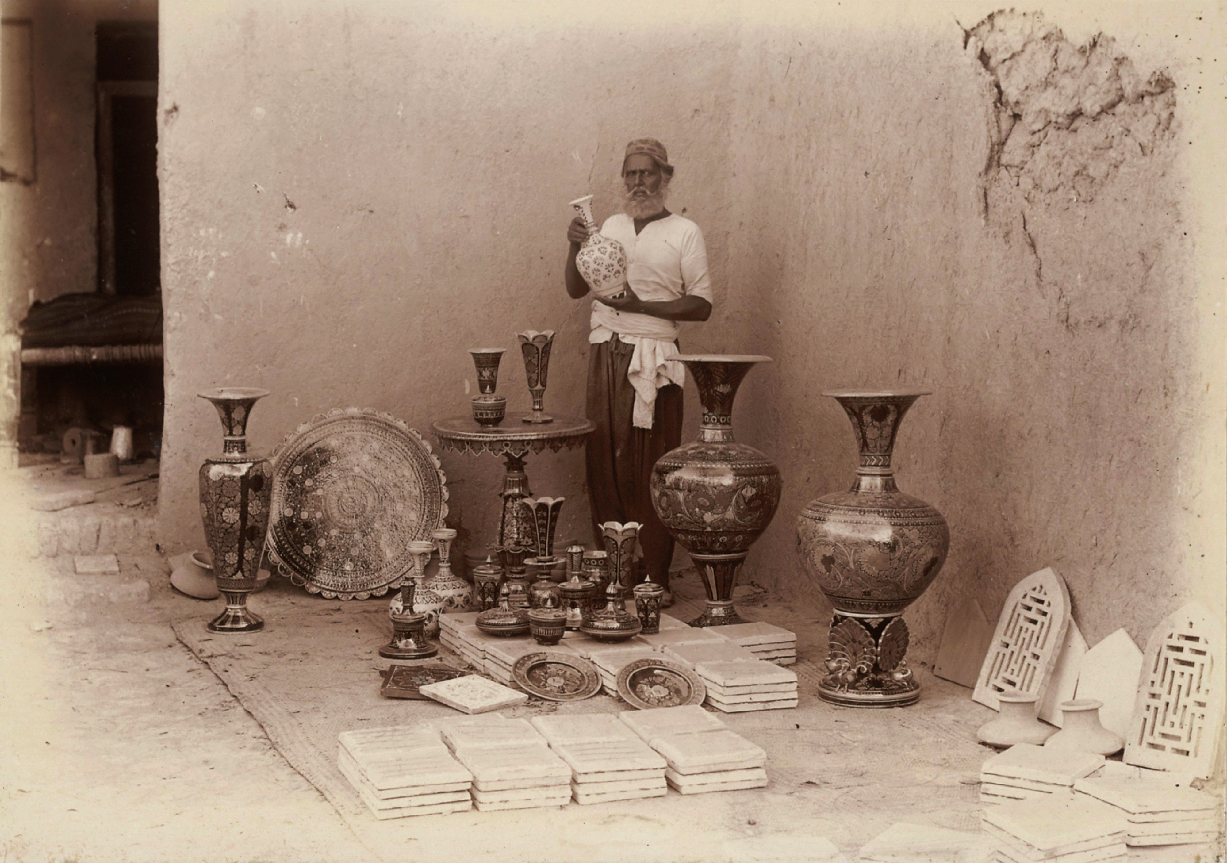 A Potter from Hala near Moro in Sindh with examples of Hala Pottery ...