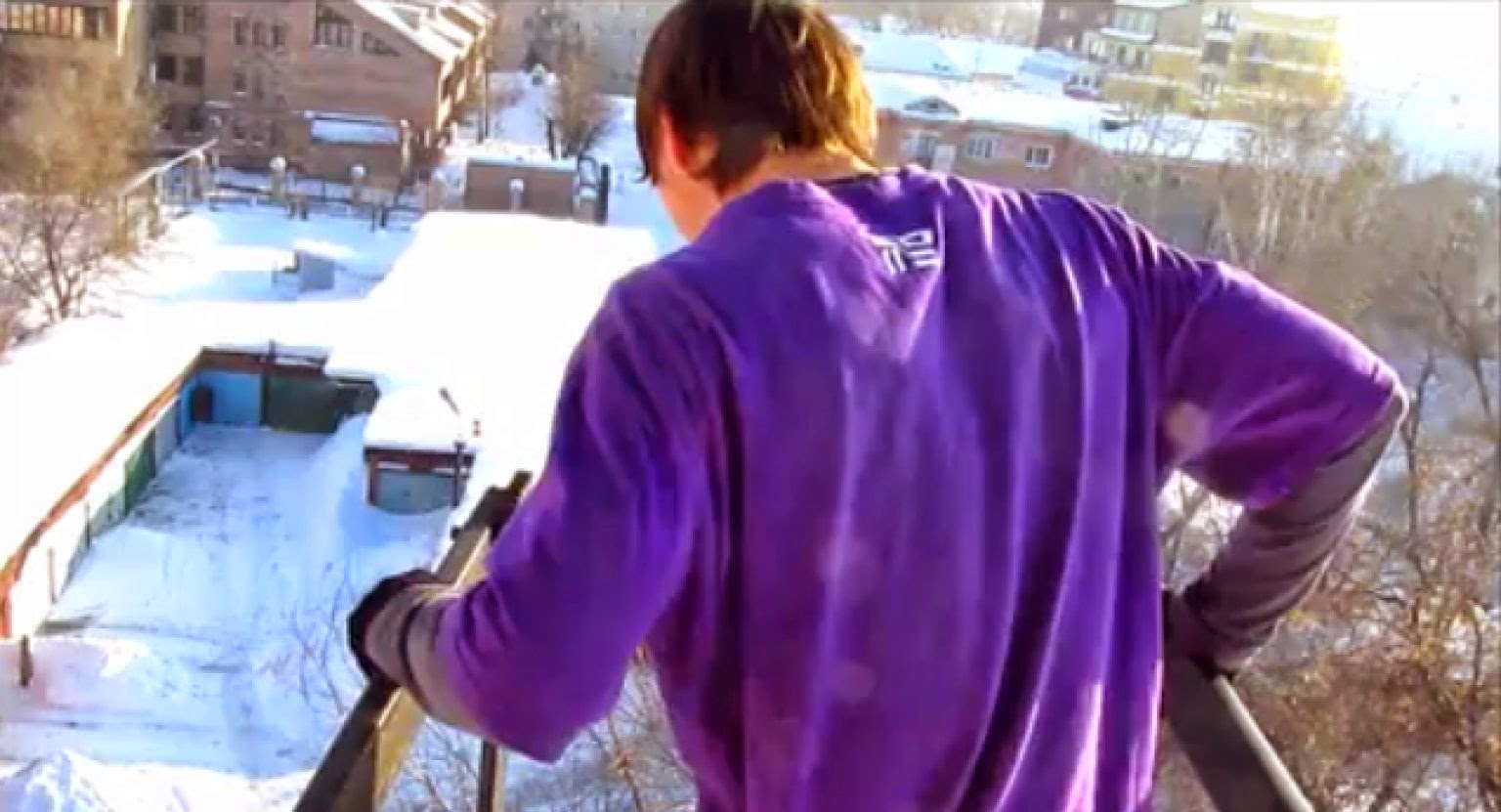 Russian Guy Jumps Into Snow From Roof Of Building... Because That's ...