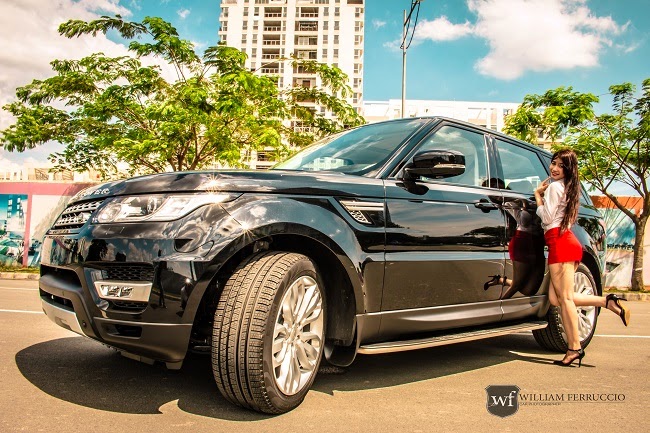 Rebellion office girl poses with Range Rover Sport | Carsfresh