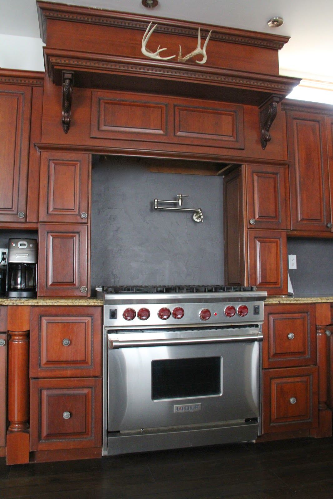 Sheer Serendipity: Charcoal black plaster backsplash