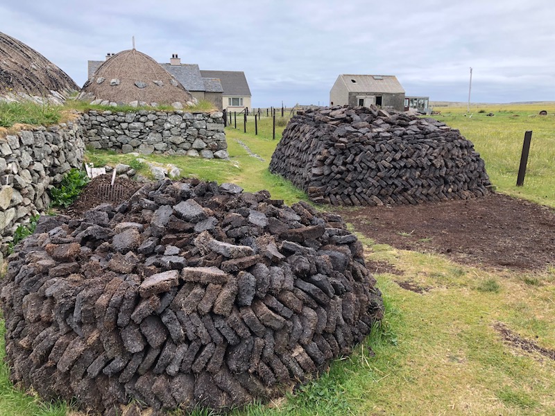 Peat stacks at the Arnol Blackhouse on Lewis