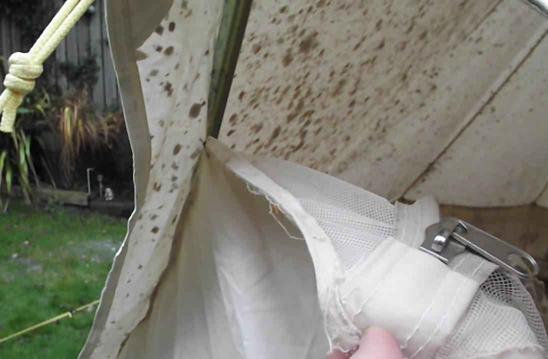 repairing a torn Bell Tent