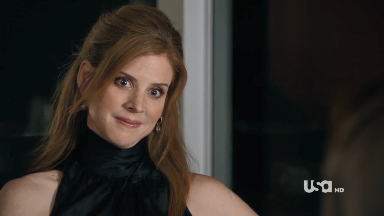 Ladies in Satin Blouses: Sarah Rafferty - black satin halter top
