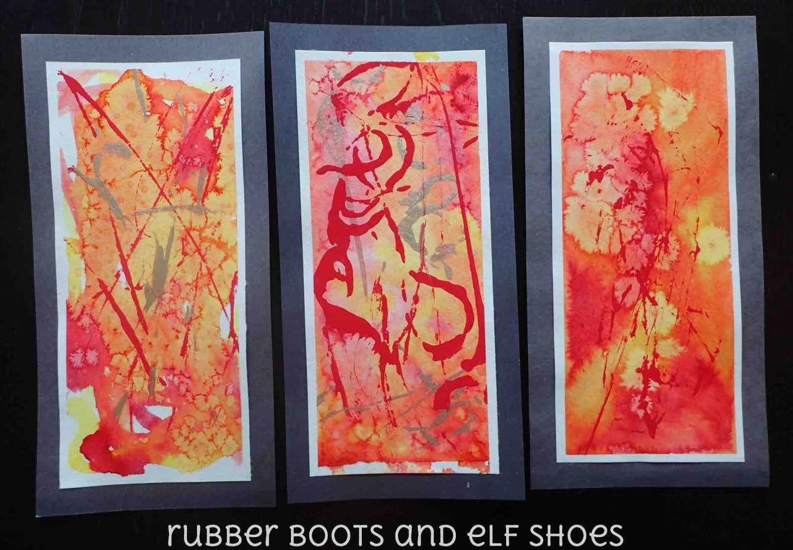 process art - painting with red and gold - rubber boots and elf shoes