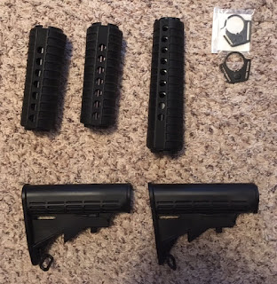 Three M4 Stocks. Two M4 Sling Mounts. Two AR Buttstock Mag Pouches. Two ...
