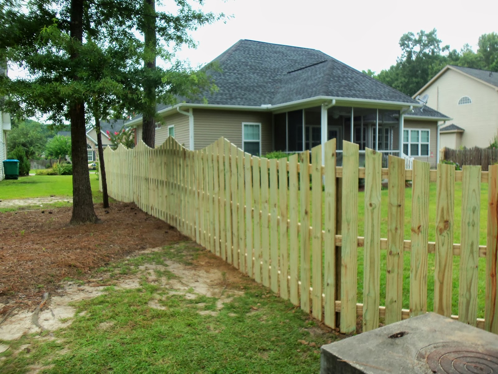 Town & Country Fences, LLC: A Pine Forest Fence to Match Neighbor's