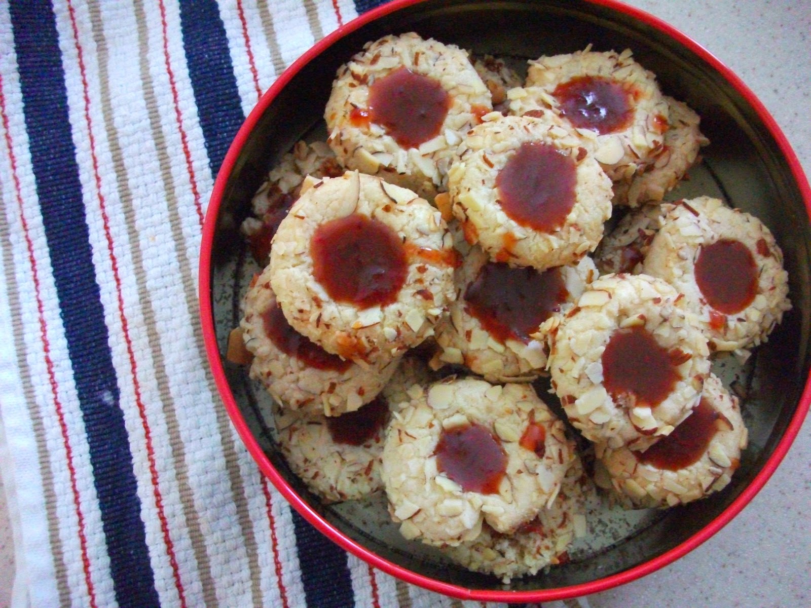 the tomato and the girl: almond thimble cookies with cranberry caramel