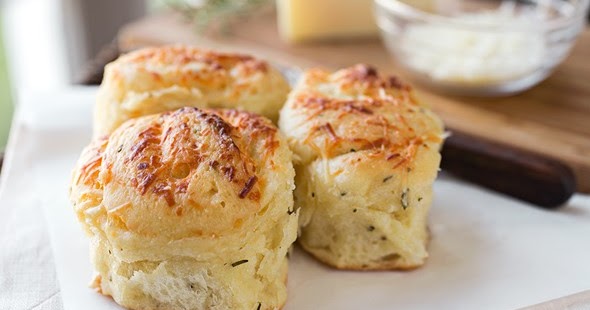 Light and fluffy dinner rolls are infused with fresh rosemary