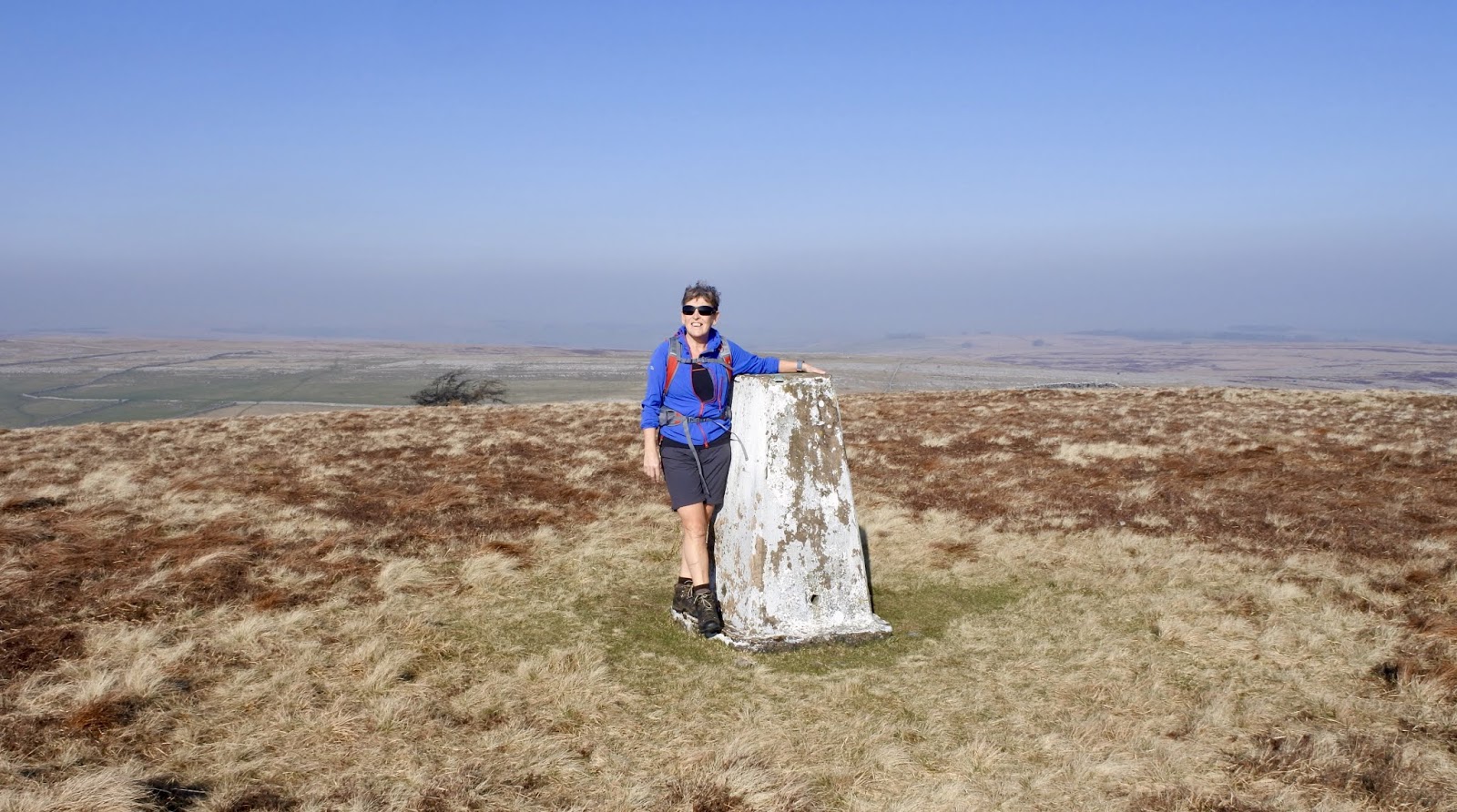 Great Asby limestone pavement, cairns and an OS trig point at the Knott ...