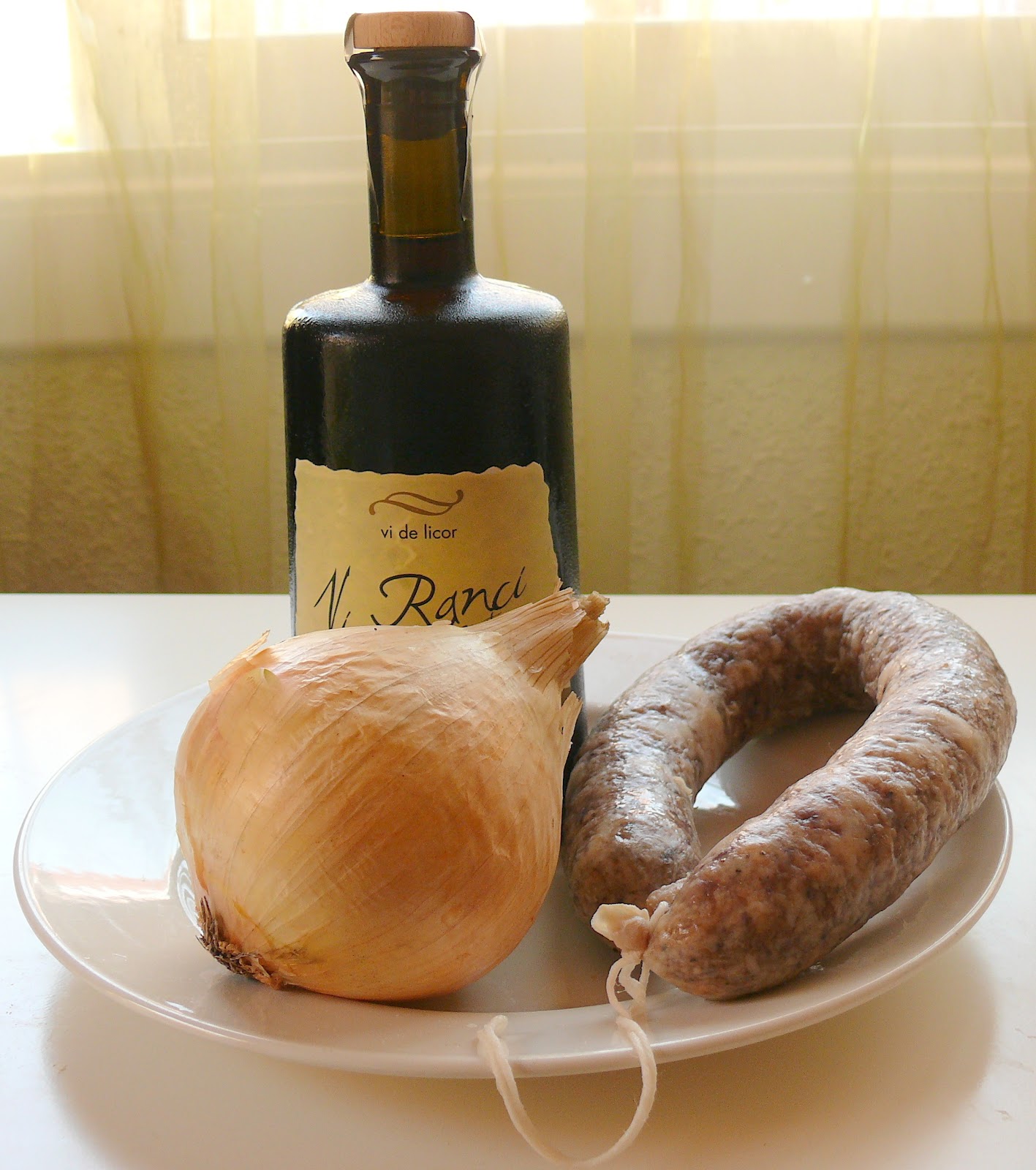 Tapa't de tapes: Botifarra de perol amb ceba confitada amb vi ranci